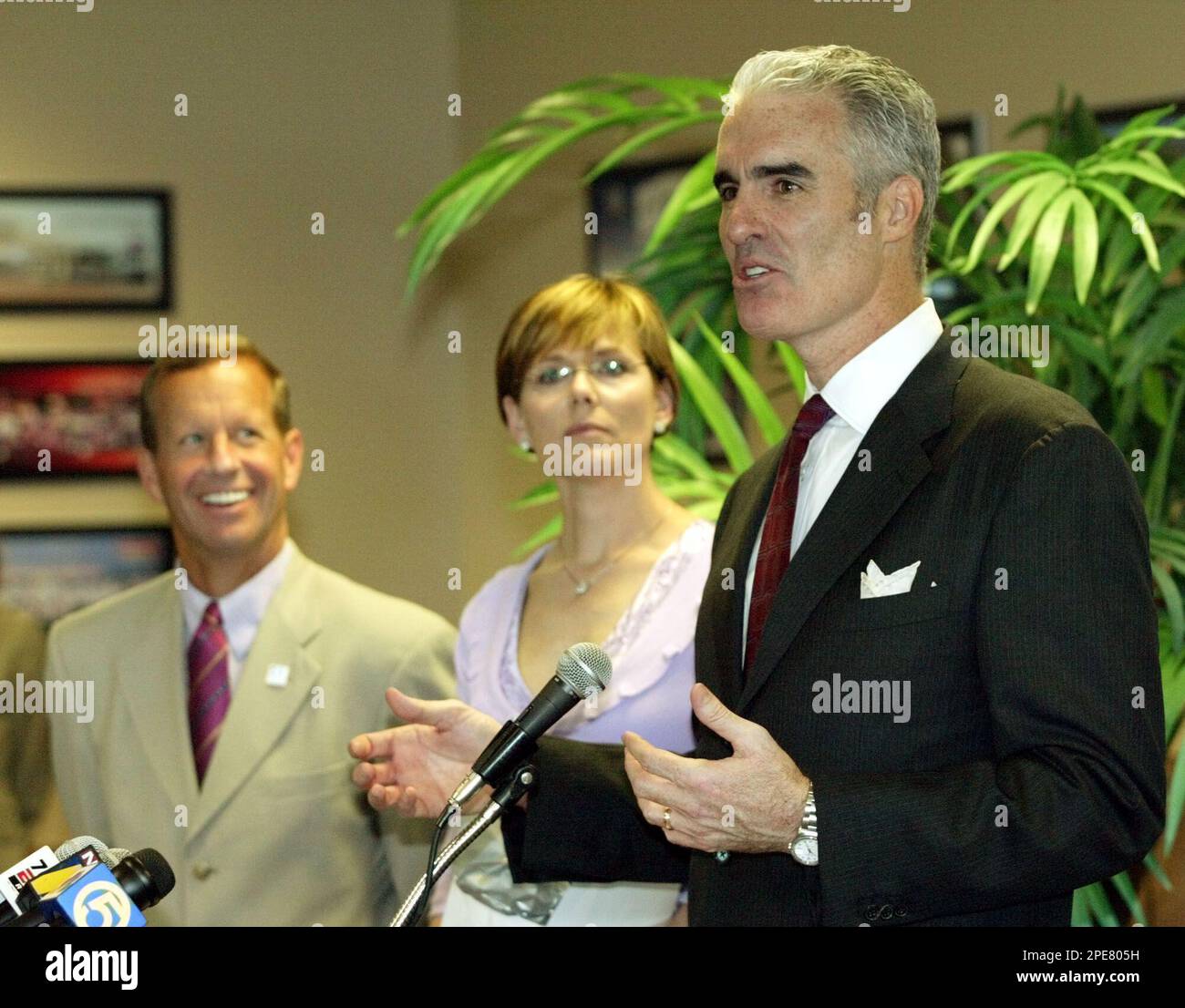 Matt Doherty, right, speaks Monday, April 18, 2005, after being named ...