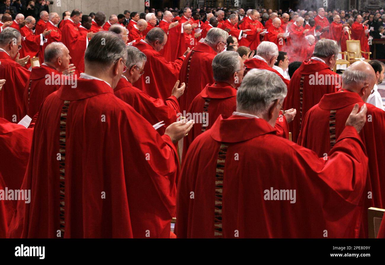 Cardinals raise their hands in prayer during a Mass in St. Peter's ...