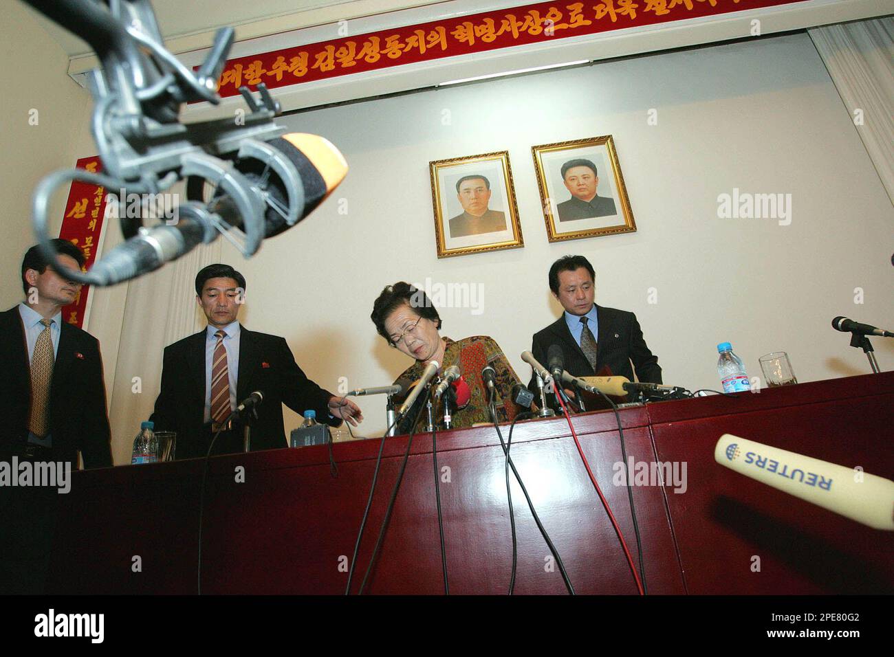 Ahn Pil Hwa, second from right, takes her seat before a news conference ...