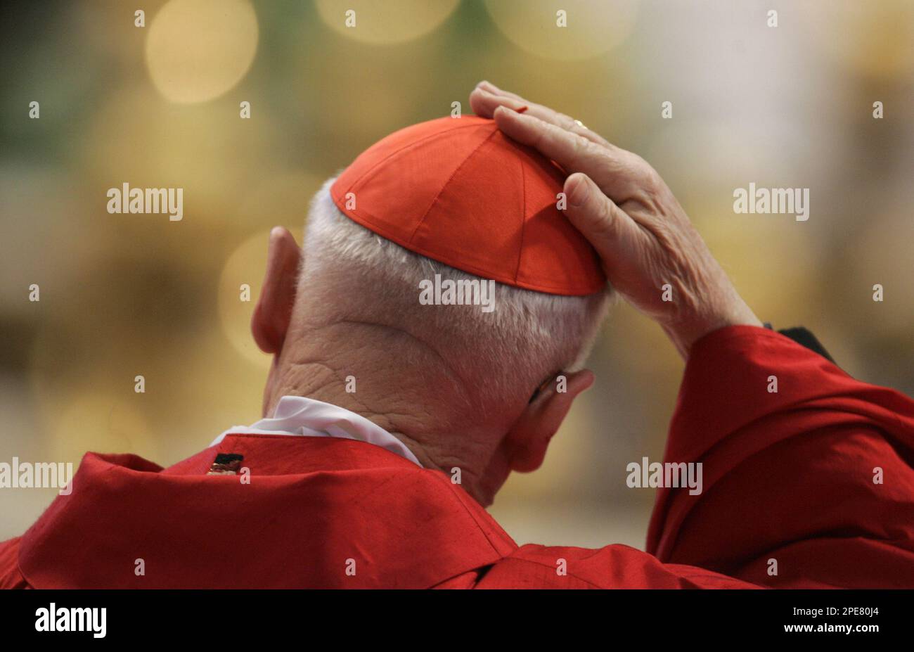 A cardinal holds his skullcap during a Mass in the St. Peter's Basilica ...