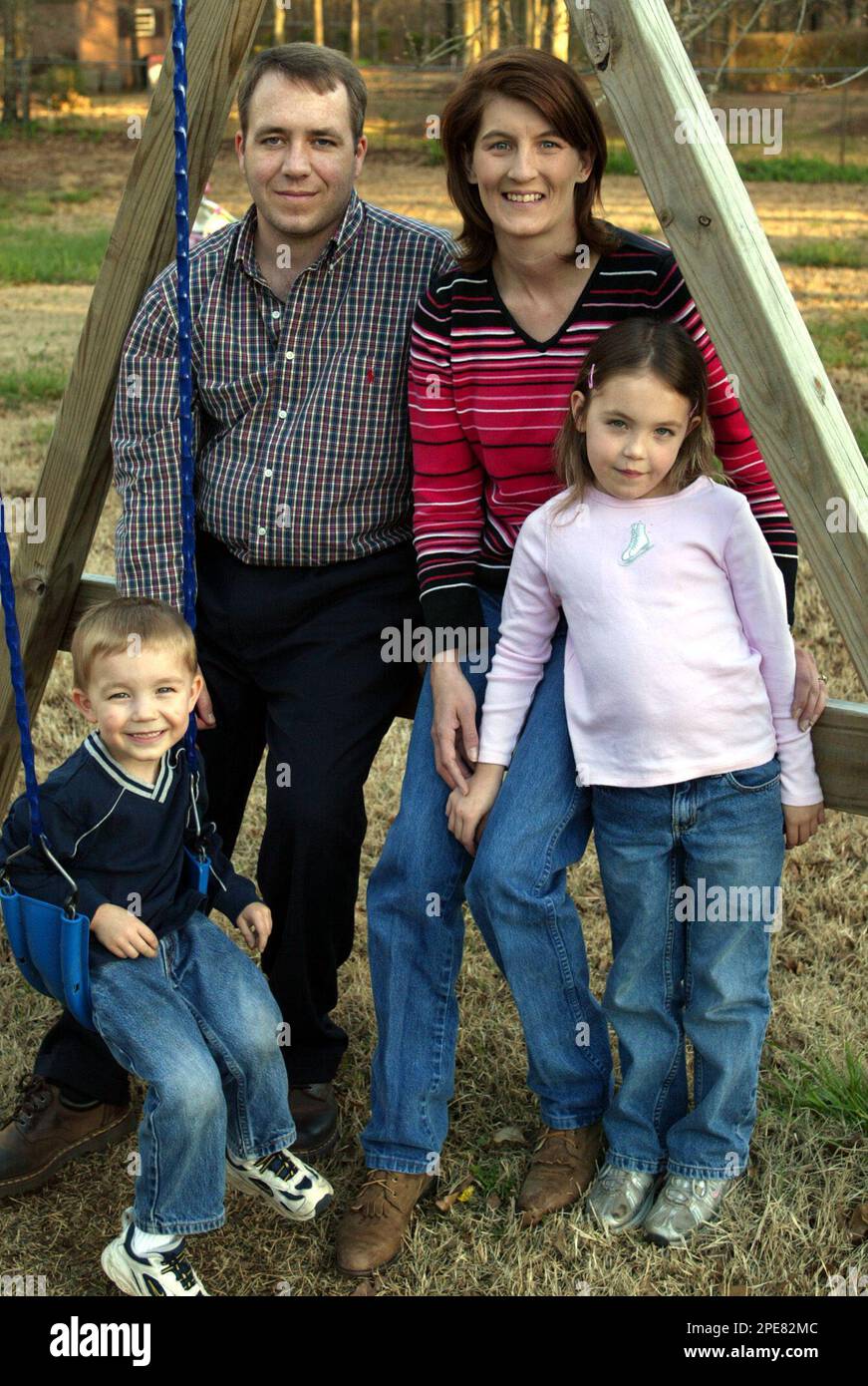 Aren Almon-Kok, upper right, poses with her husband, Stan Kok, and ...