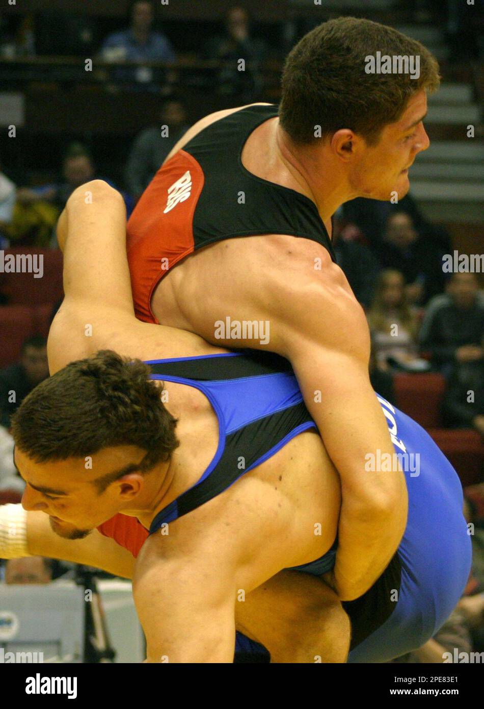 Russia's Alexey Mishin, top, wrestles Bulgaria's Nikolai Stoyanov ...
