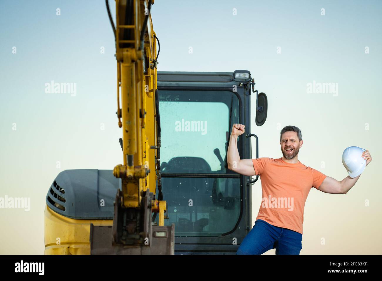 Worker with bulldozer on site construction. Man excavator worker ...