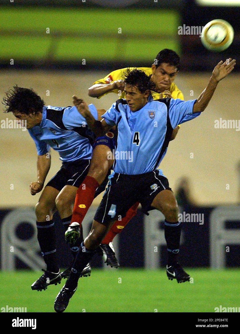 Colombia's Alejandro Bernal, right, heads a ball beside Uruguay's Elias ...