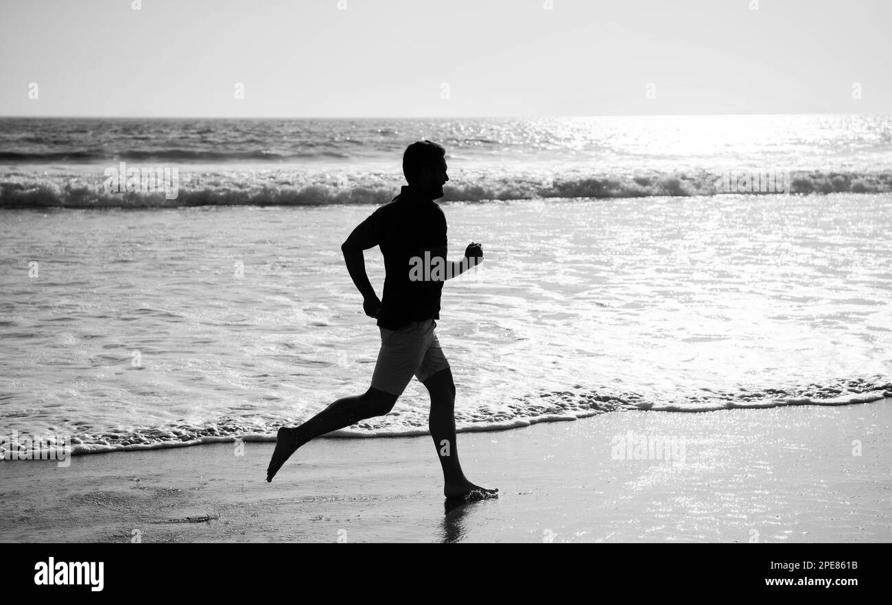 sportive man running on beach. energetic summer. runner feel freedom ...