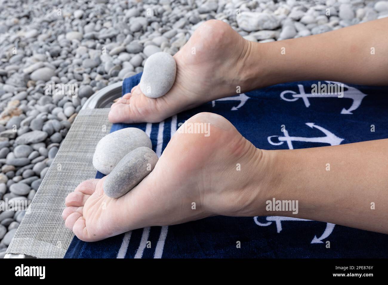 Feet massage pebbles hi-res stock photography and images - Alamy