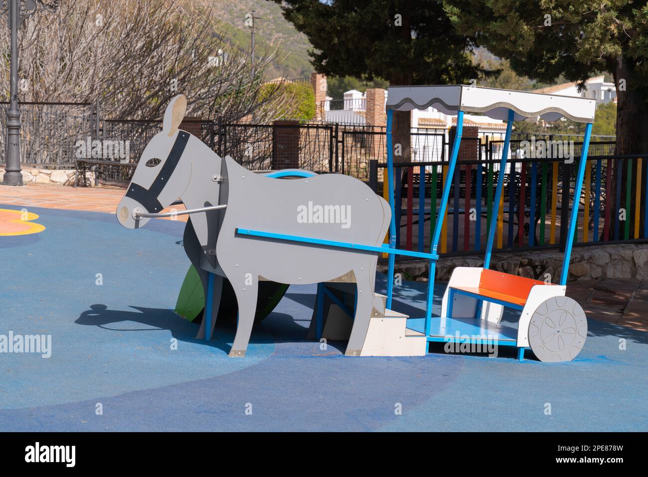 Children`s play area with donkey and cart equipment in Spanish white ...