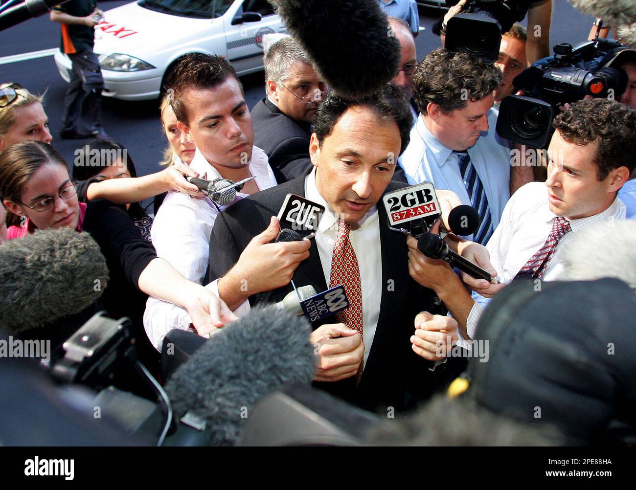 Former director of HIH Insurance Rodney Adler, center, is surrounded by ...