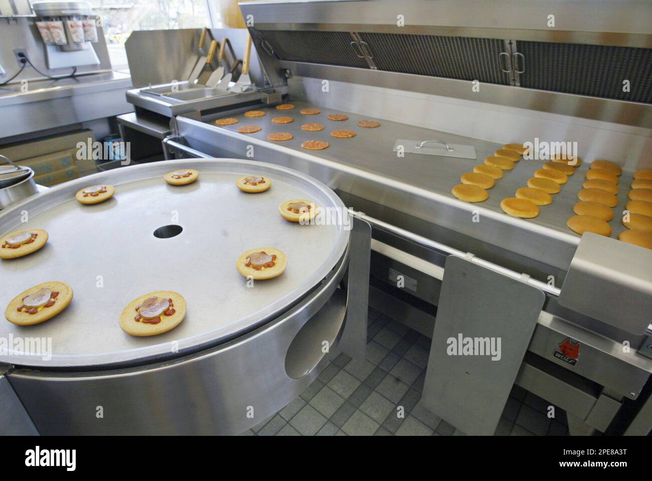 Fake meat patties and buns are part of the display in the work areas in ...