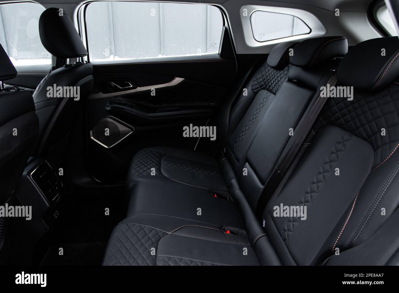 Modern car interior. Clean rear seats with the belts. Three rear seats ...