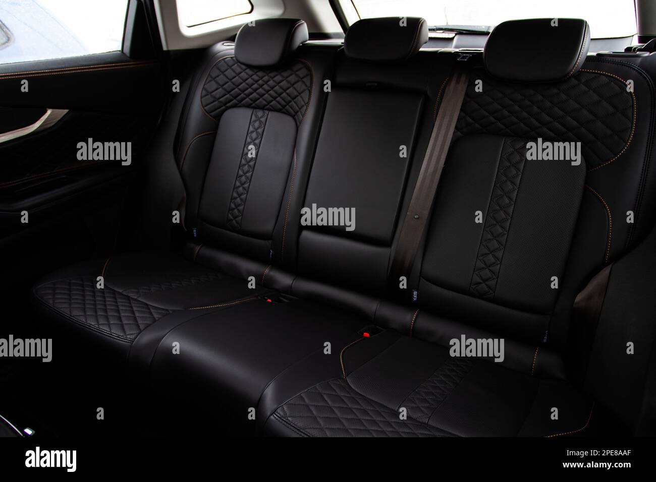 Modern car interior. Clean rear seats with the belts. Three rear seats ...