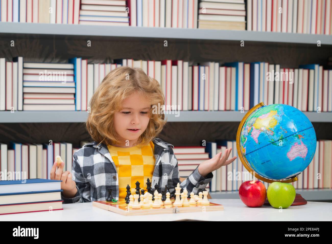Chess school for children. Clever concentrated and thinking kid playing ...