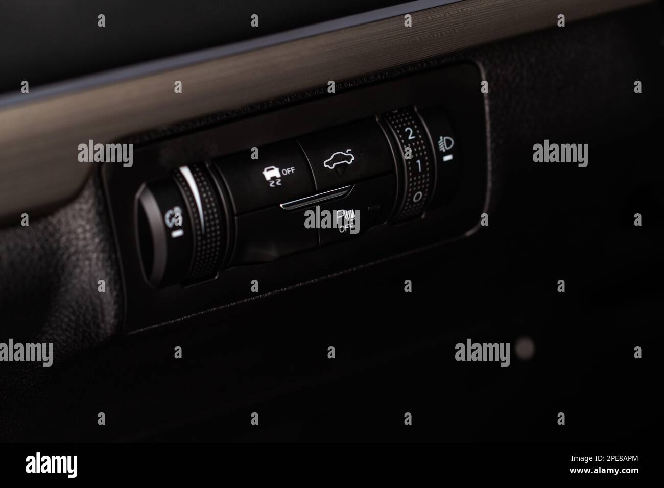Hand operating ESP (electronic stability program) control close up view ...