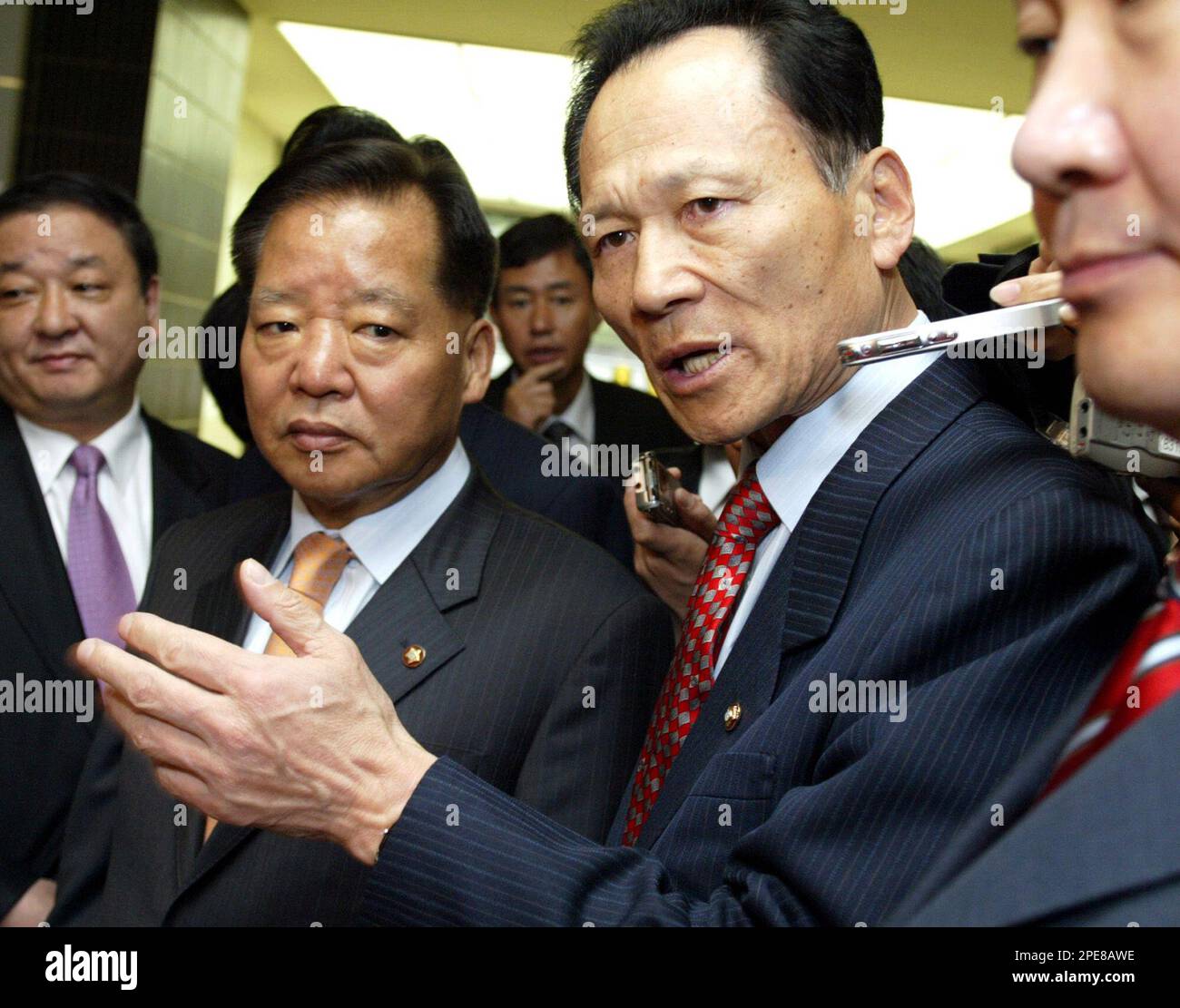 South Korean delegation member Shin Jung-sik of Uri party, second right ...