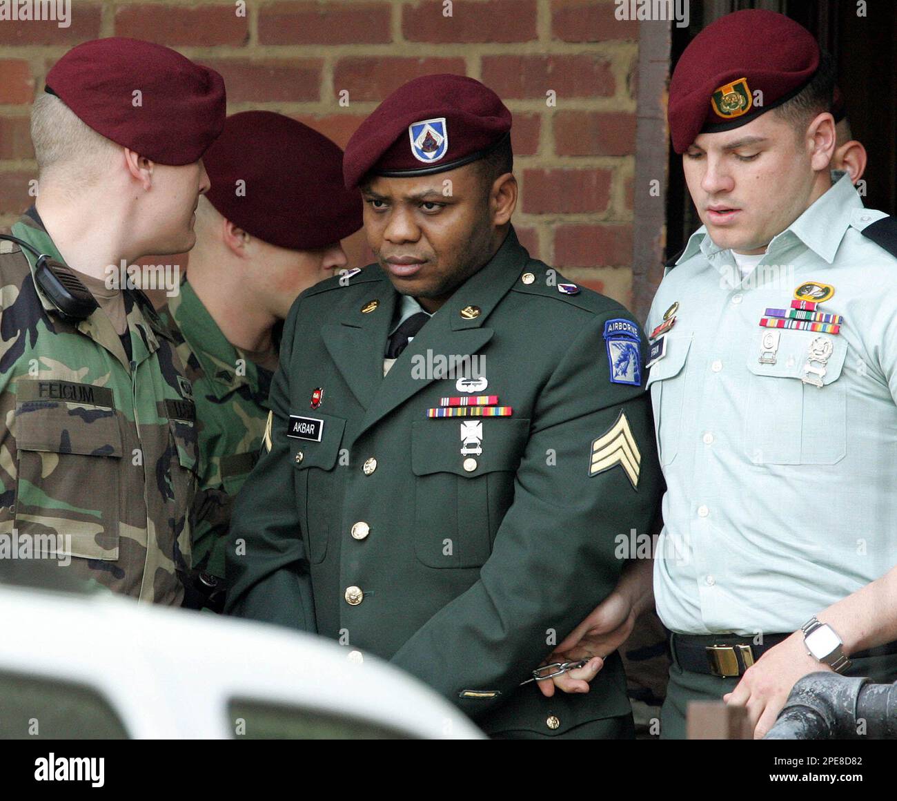 Sgt. Hasan Akbar, center, is led from the Staff Judge Advocate Building ...