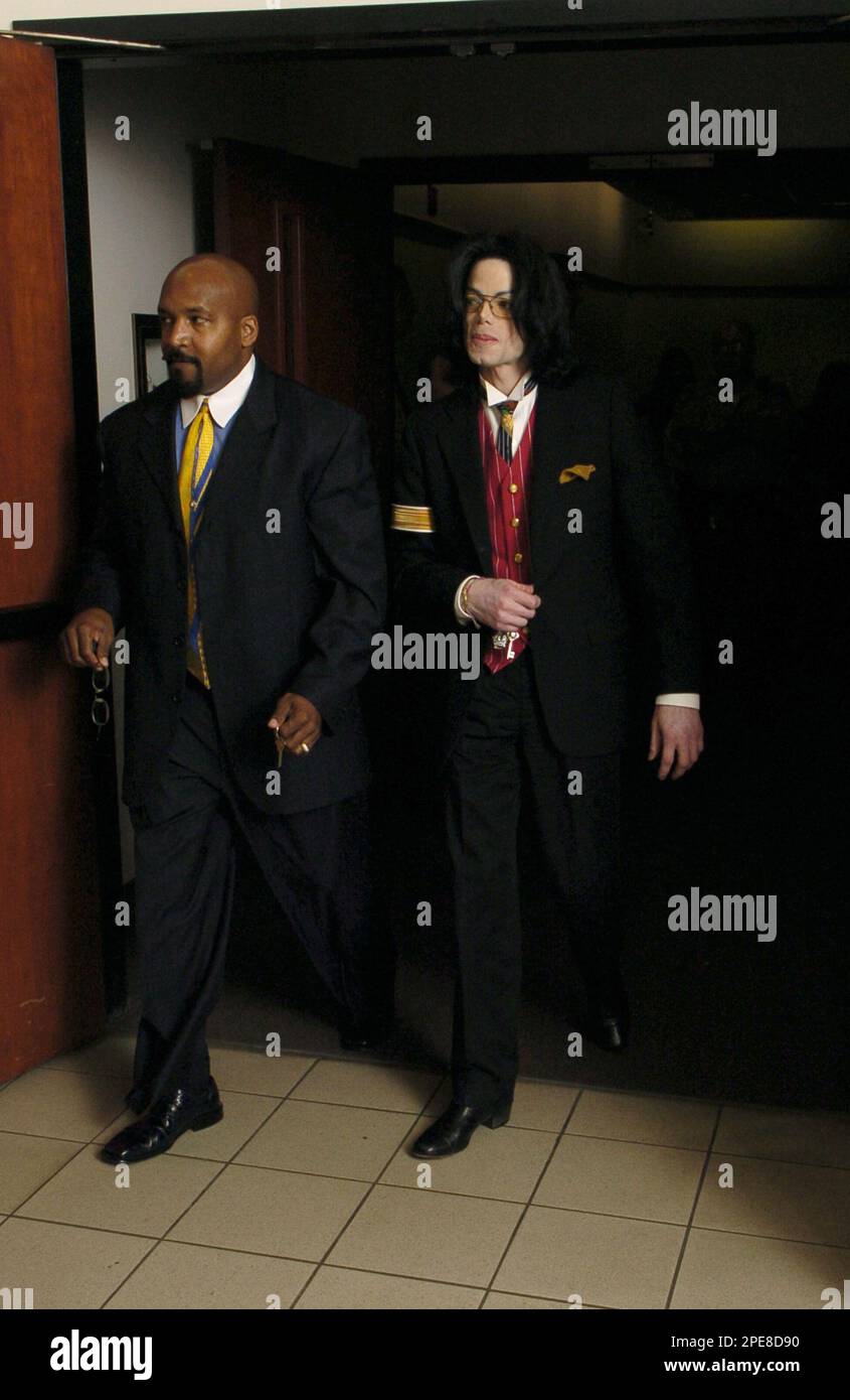 Michael Jackson enters the courtroom after a break in his molestation ...