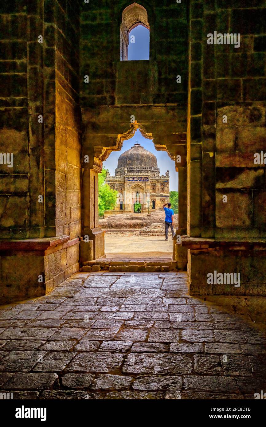 Looking at the Shisha Gumbad tomb through an arch of the Bara Gumbad ...