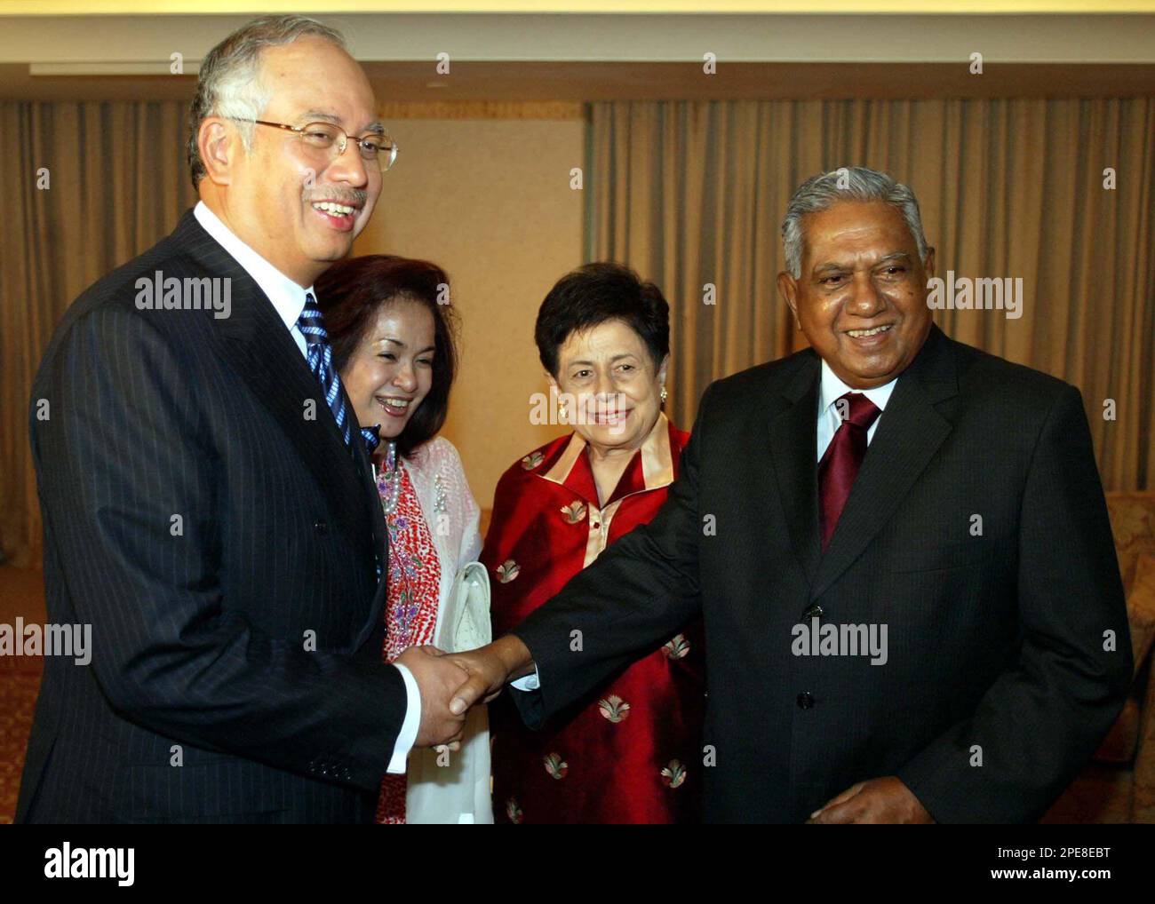 Malaysia's Deputy Prime Minister Najib Tun Razak, left, shakes hands ...