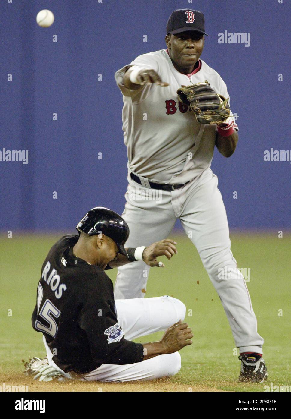 Boston Red Sox shortstop Edgar Renteria turns a double play on Toronto ...