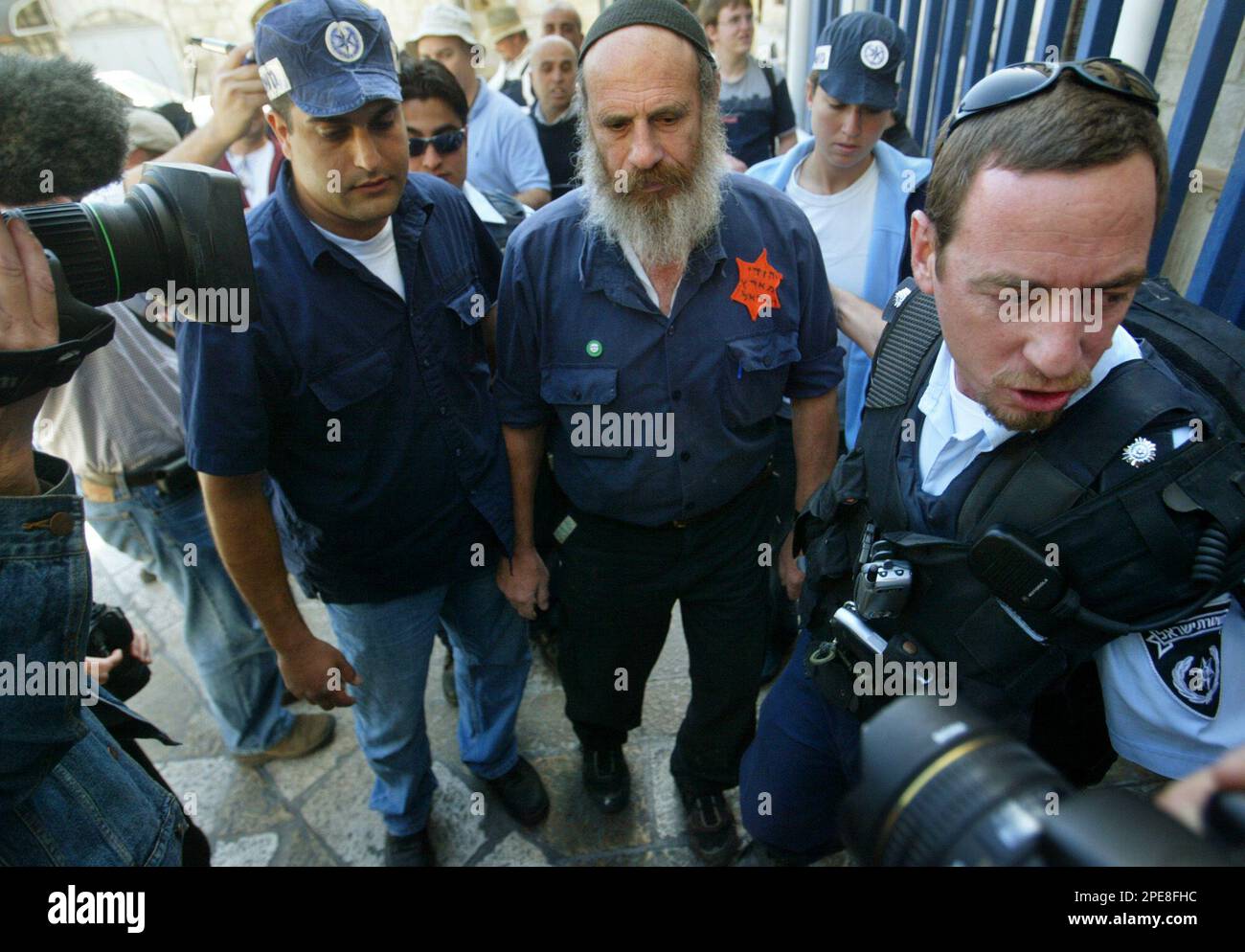 Israeli police detain an Israeli settler, Micheal Ben-Horin, centre ...