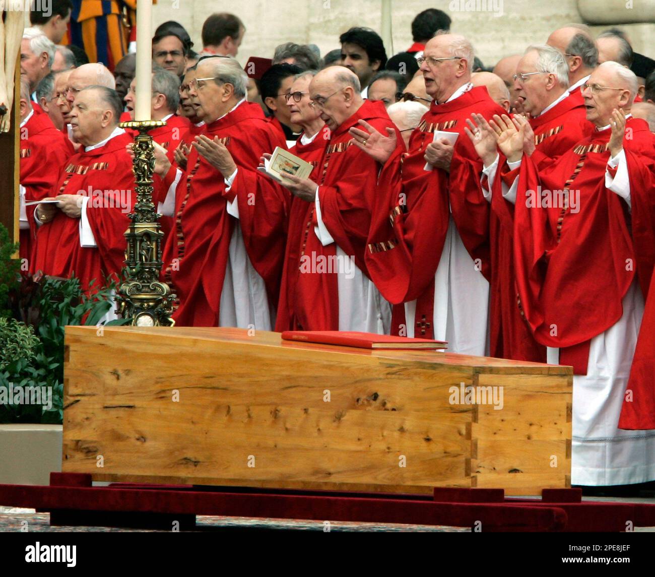 Cardinals pray over the wood casket bearing the body of Pope John Paul ...