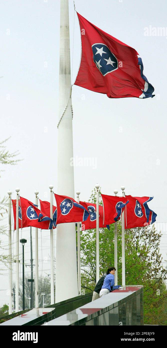 Tennessee state flags fly over visitors at the Bicentennial Mall in ...