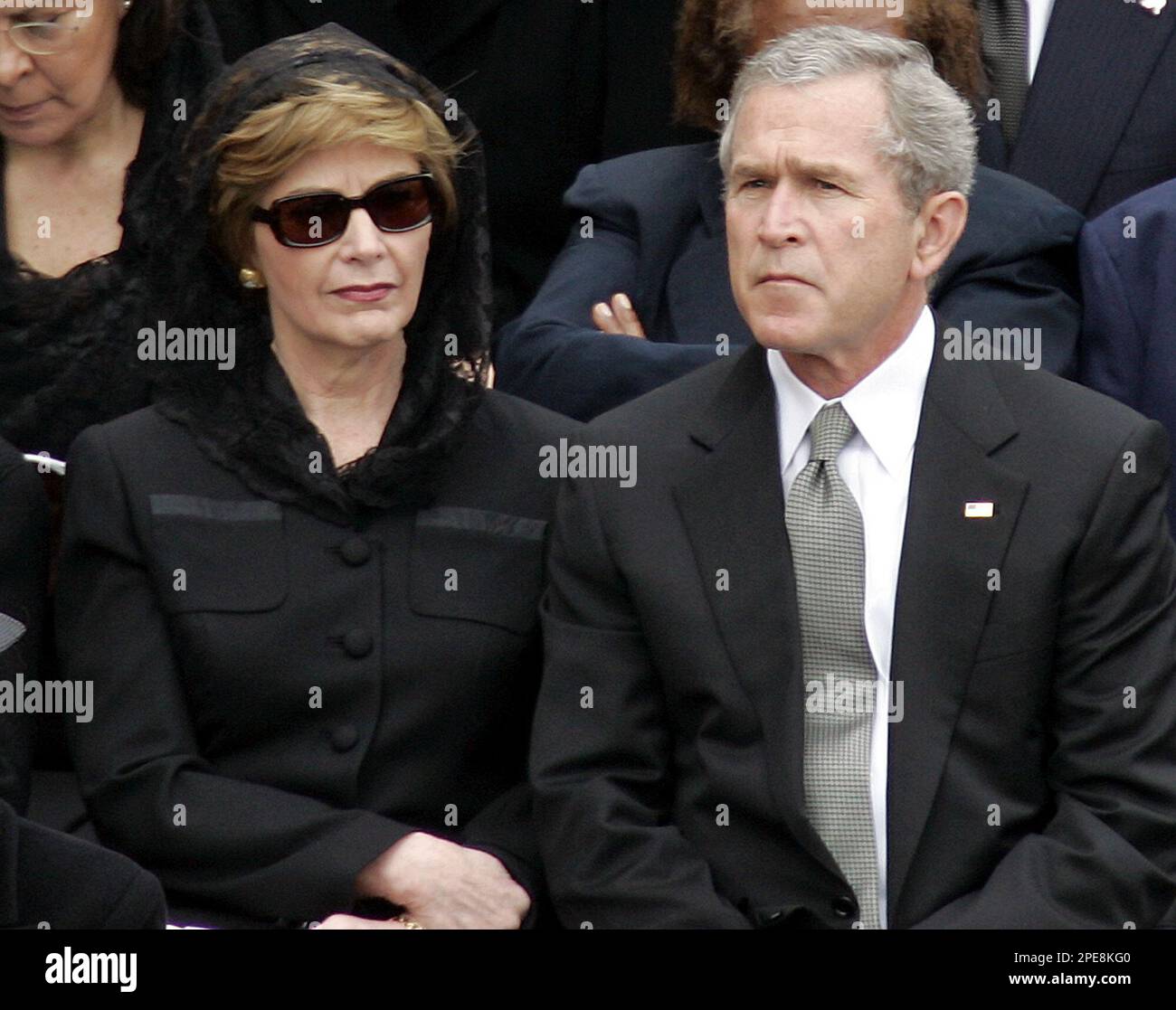 US President George Bush and first lady Laura Bush attend the funeral ...