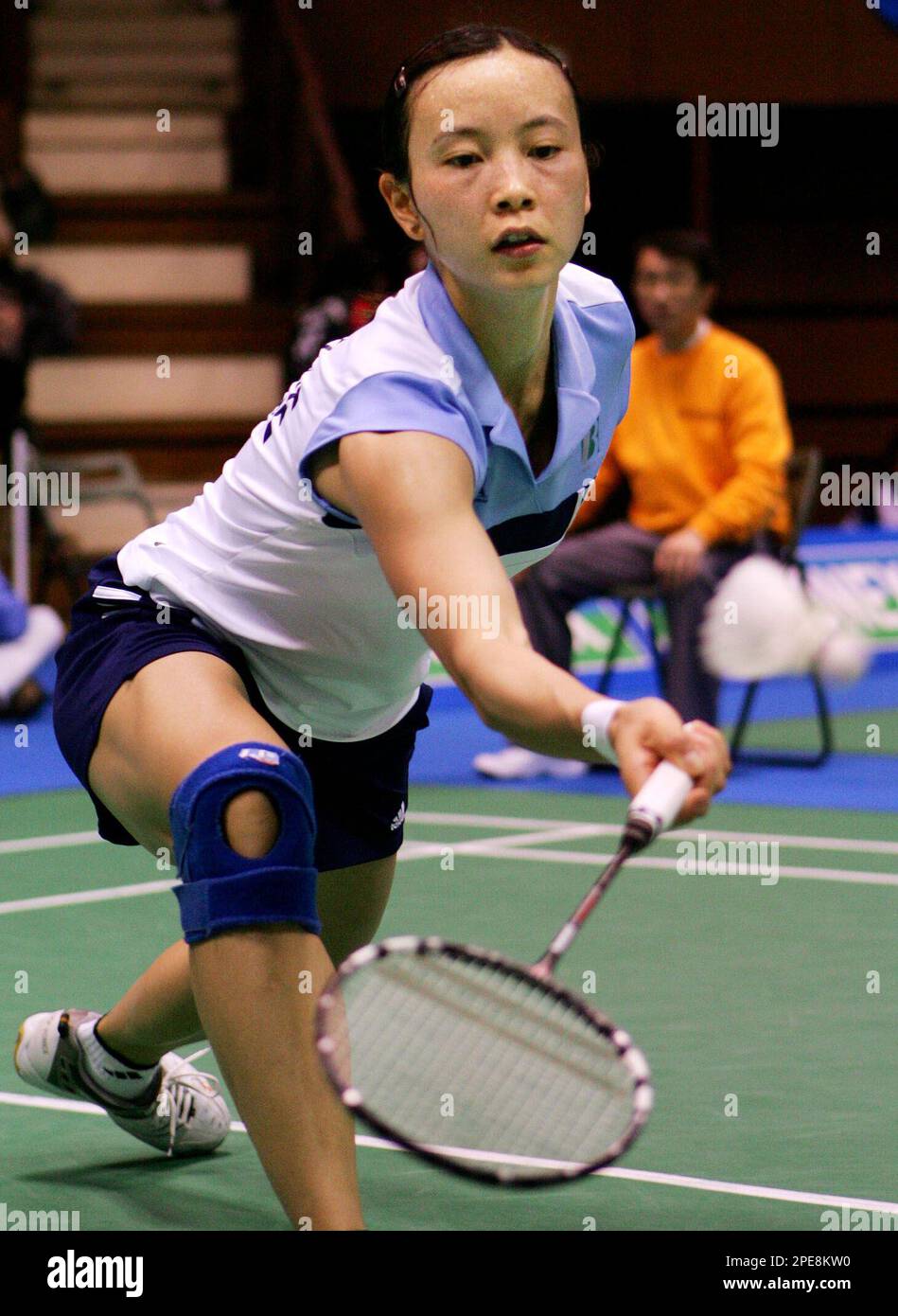 Pi Hongyan of France returns the shuttlecock against Zhu Lin of China ...