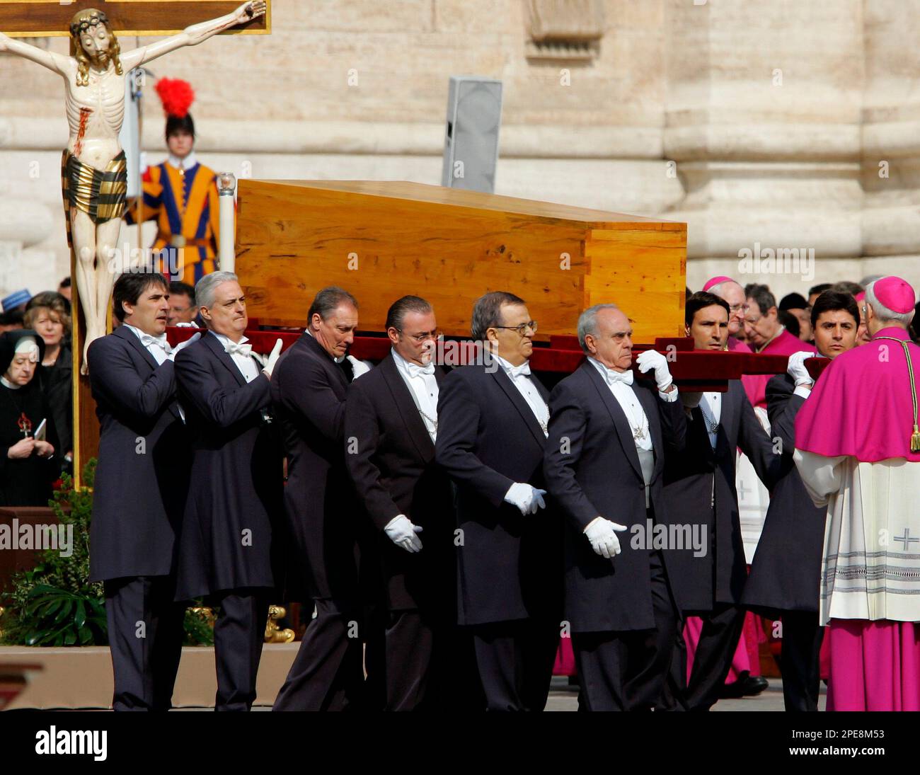 The wooden casket bearing the remains of Pope John Paul II is carried ...