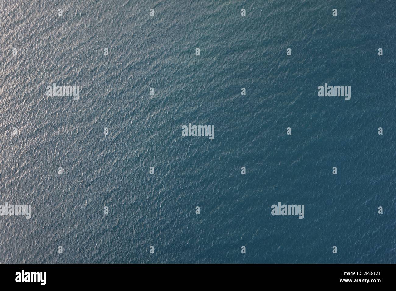 Turquoise color sea water surface aerial drone view Stock Photo - Alamy