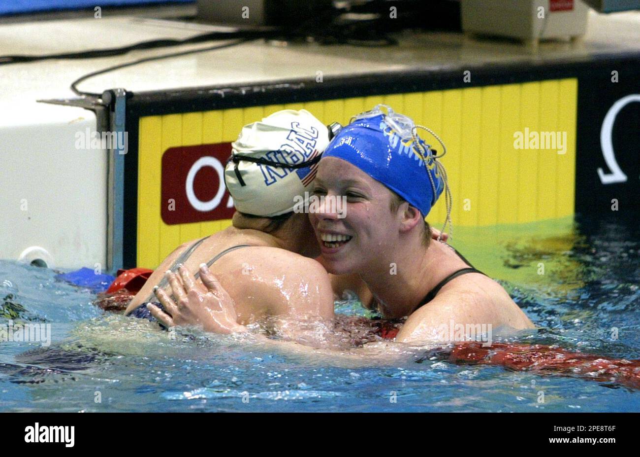 1500-meter freestyle finals winner Kate Ziegler, right is congratulated ...