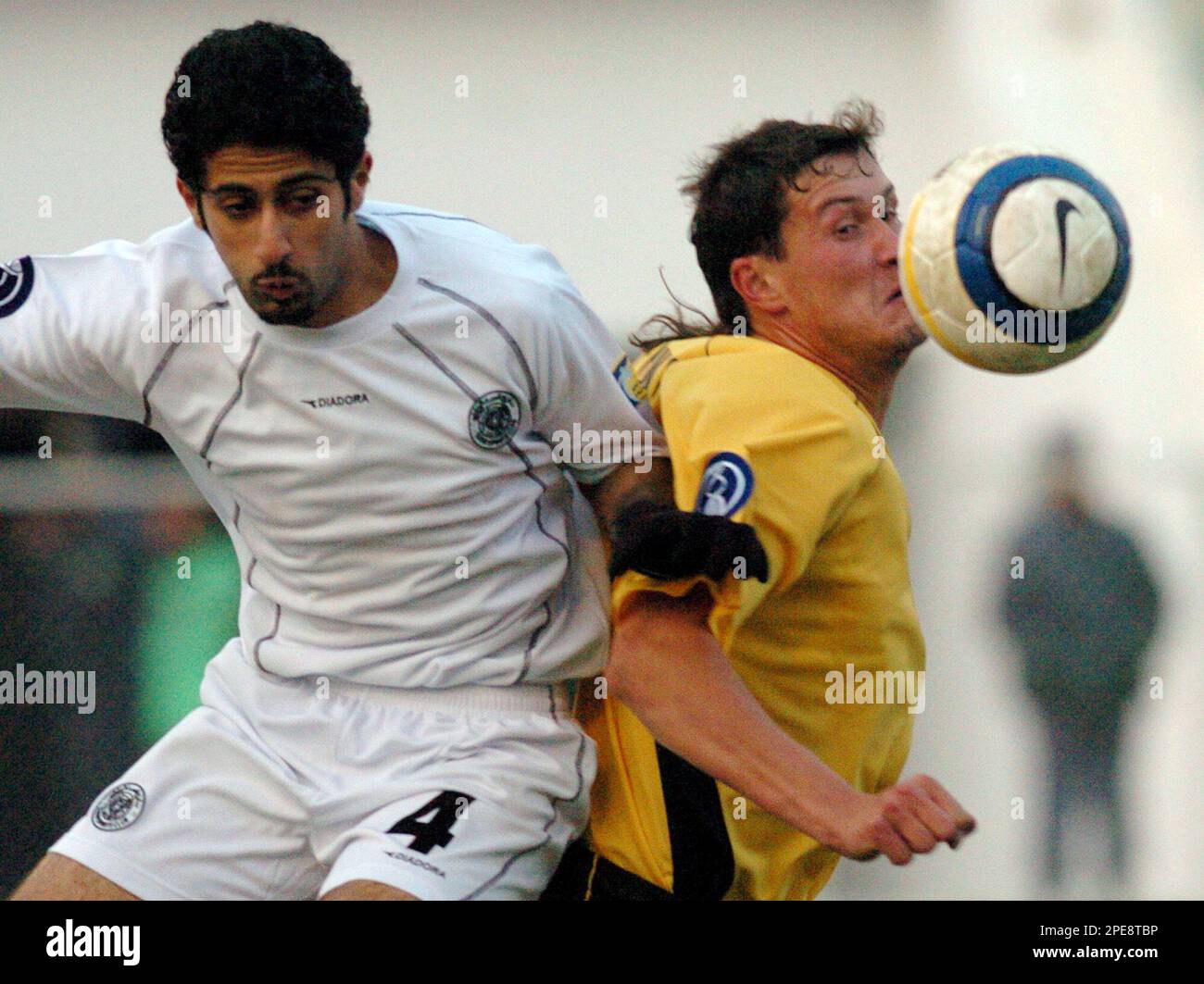 Al Sadd's Abdulla Al-Berik, left, fights for the ball with Neftchi's Ilya Kovalenko during Asian ...