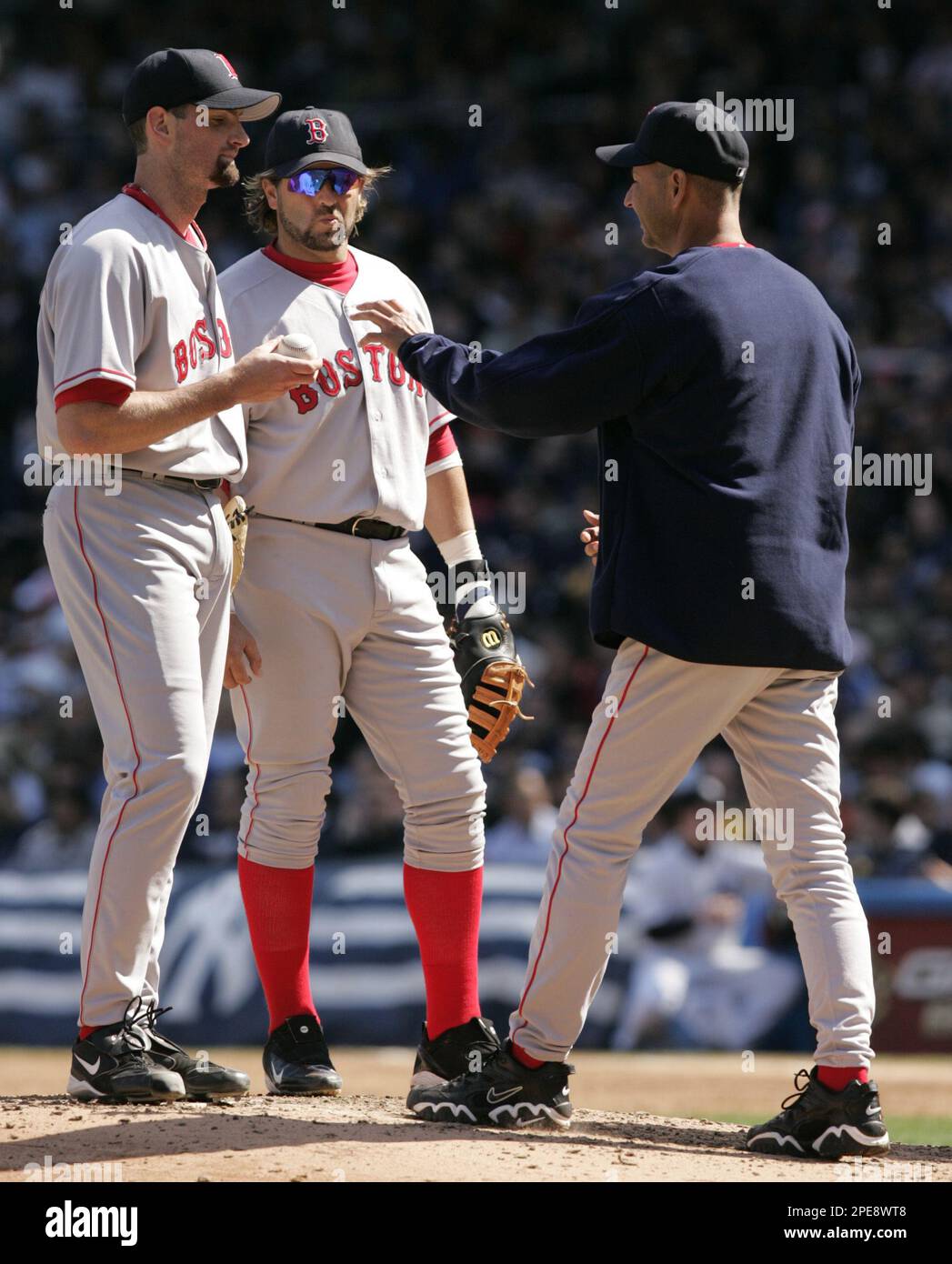 Boston Red Sox pitcher Matt Clement, left, hands the ball over to ...