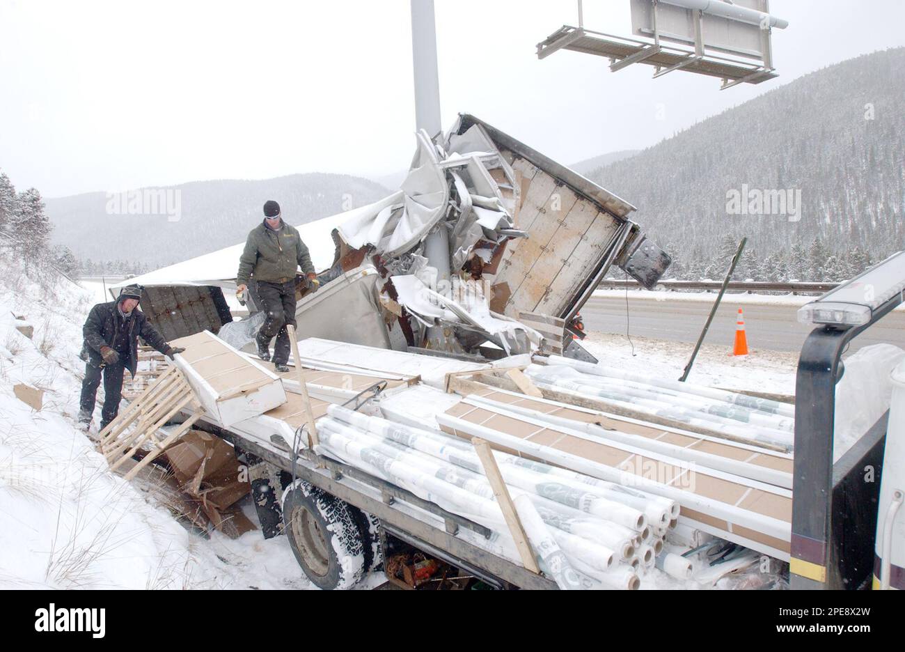Rich Philippus, left, and Rich Wachter, right, salvage cargo from a ...