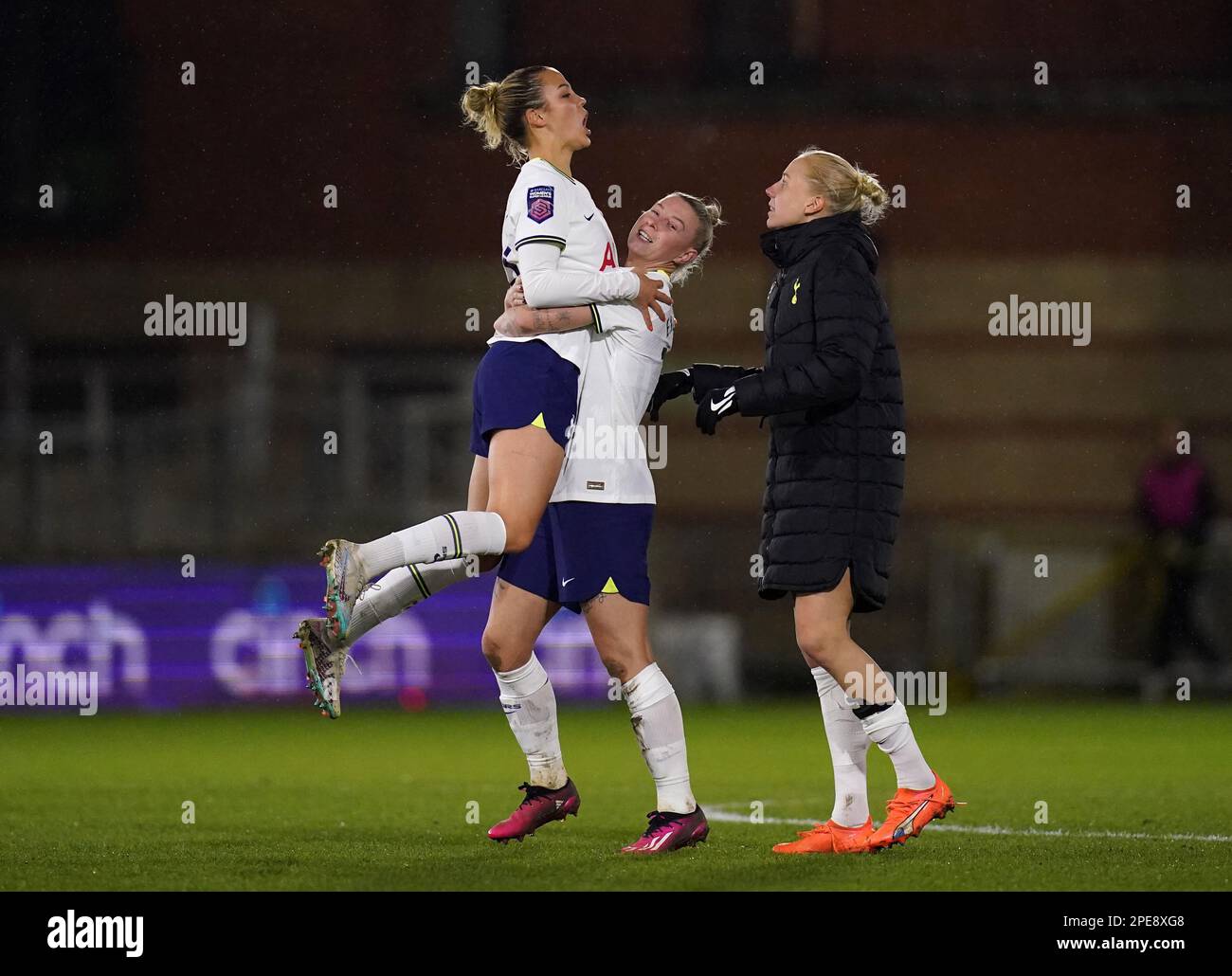 Tottenham Hotspur's Bethany England (centre) lifts up Celin Bizet ...