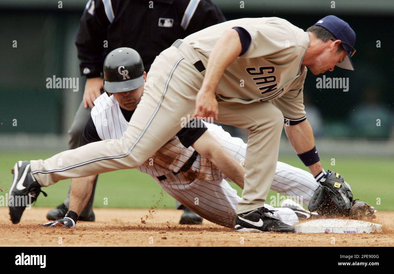 San Diego Padres shortstop Mark Loretta, front, applies a late tag to ...