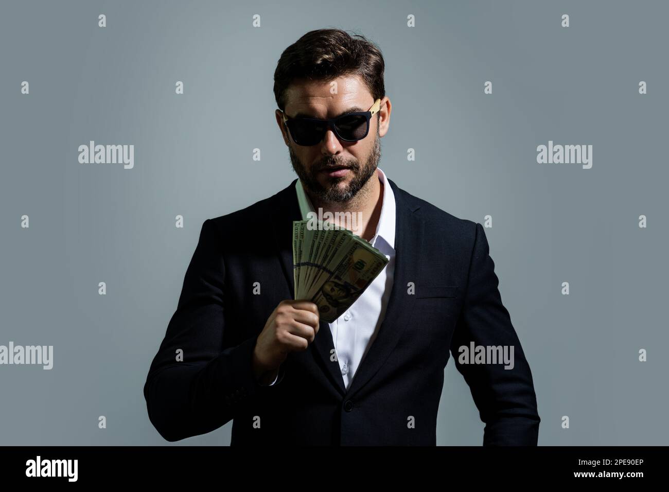 Business man in t-shirt with cash money dollars banknotes isolated on ...