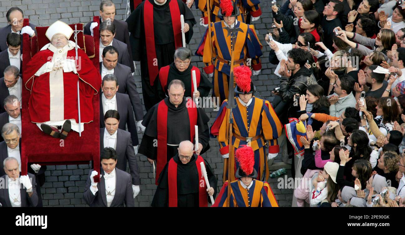 Late Pope John Paul II is carried to St. Peter's Basilica at the ...