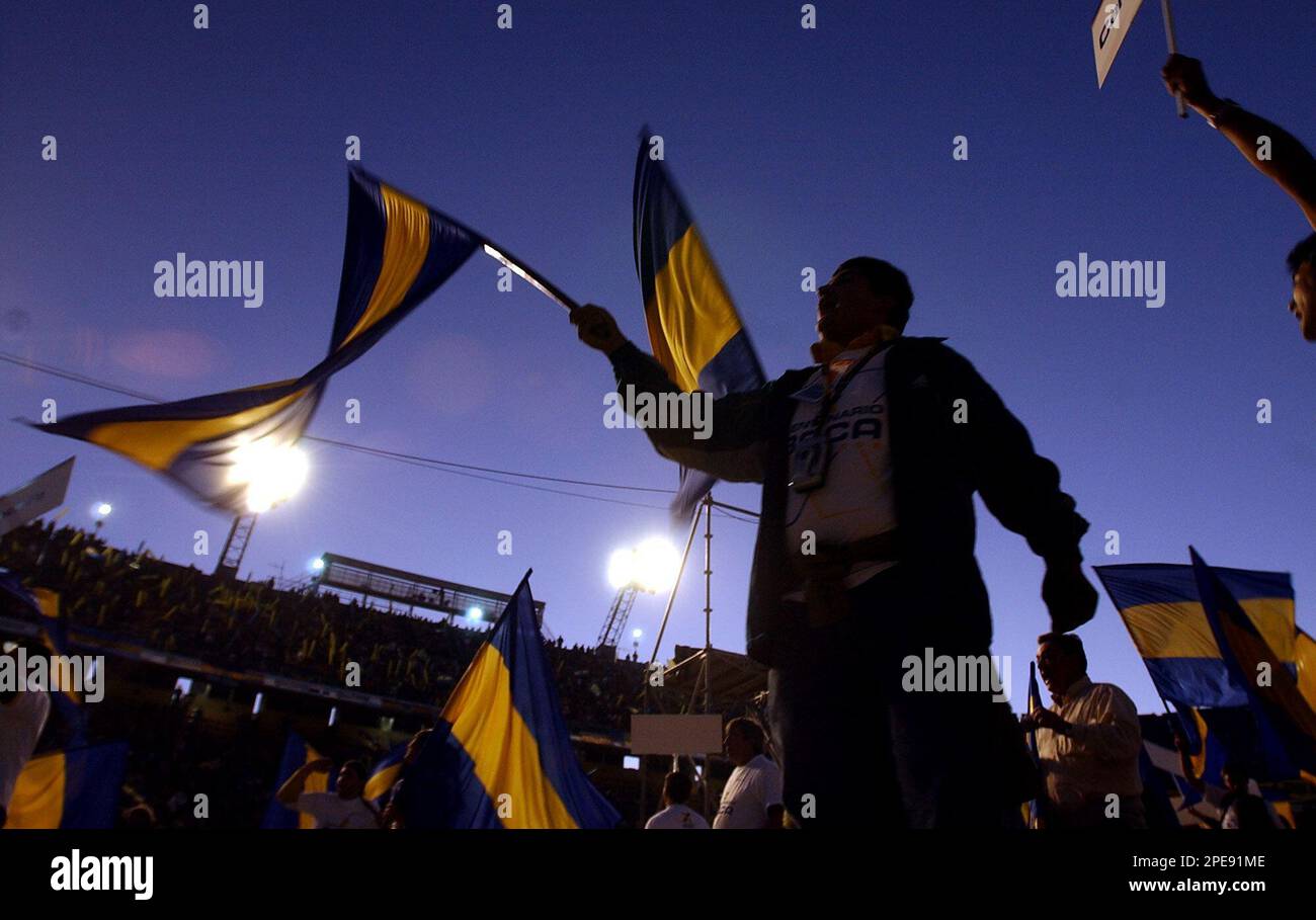 Boca Juniors fans hold flags representing the club at the "Bombonera ...