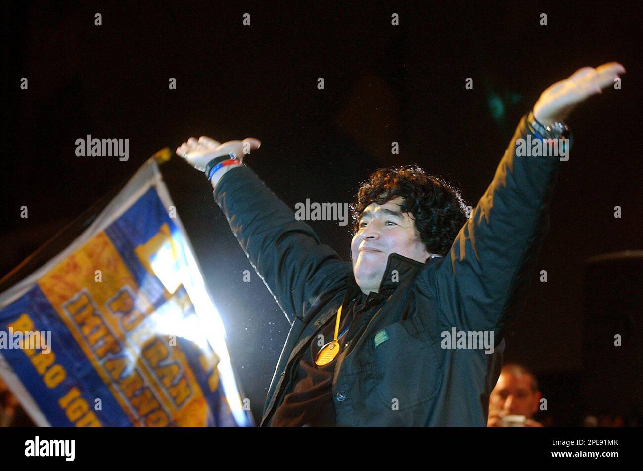Former soccer player Diego Maradona cheers to fans at the "Bombonera ...