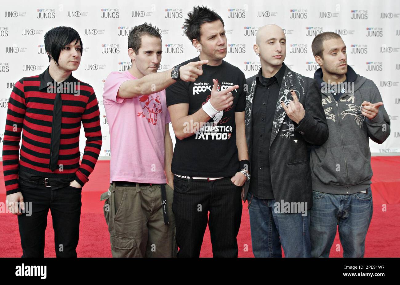 Members of Simple Plan pose for photographers as they arrive on the red ...