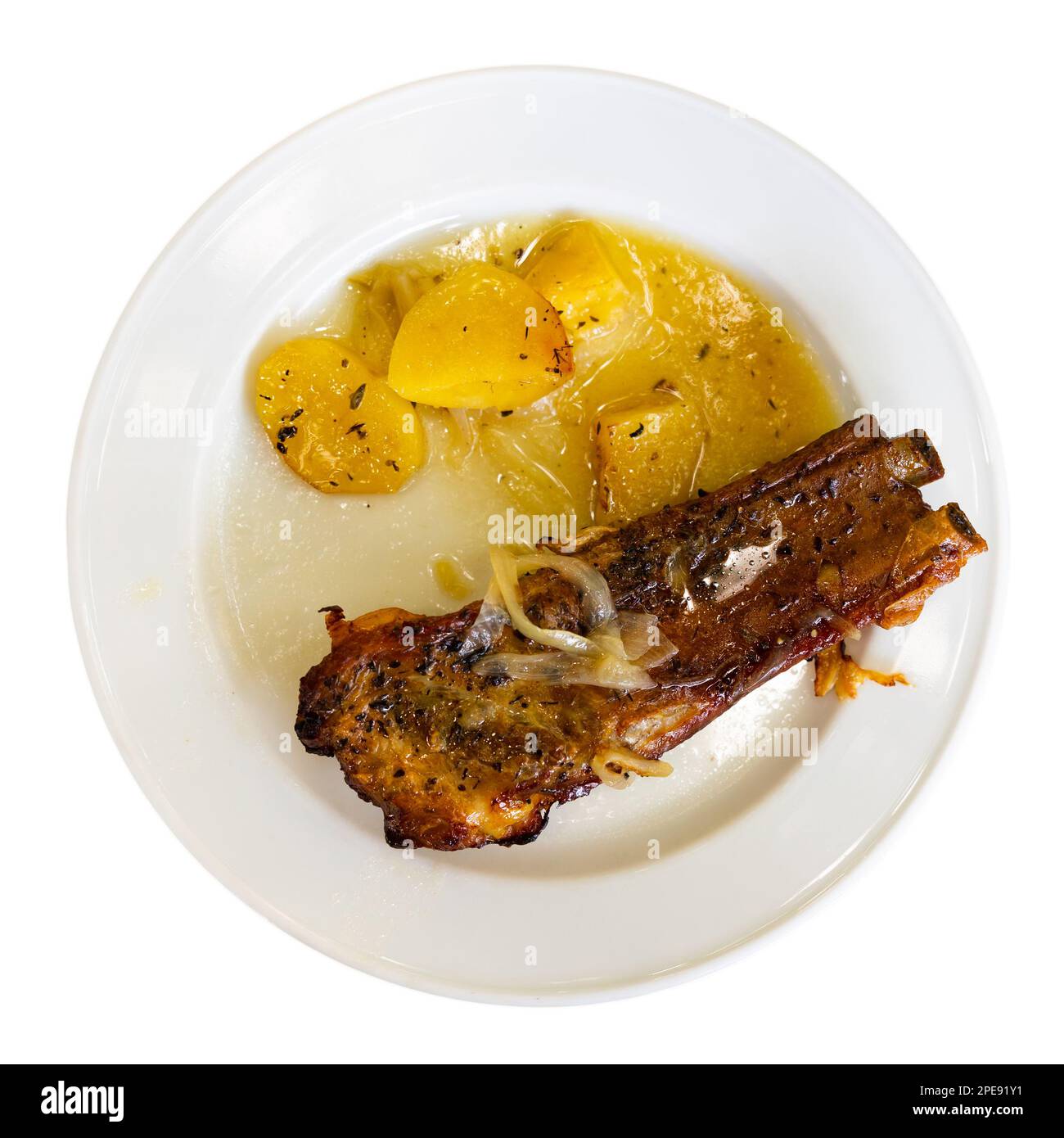 Delicious fried pork ribs with baked potatoes Stock Photo - Alamy