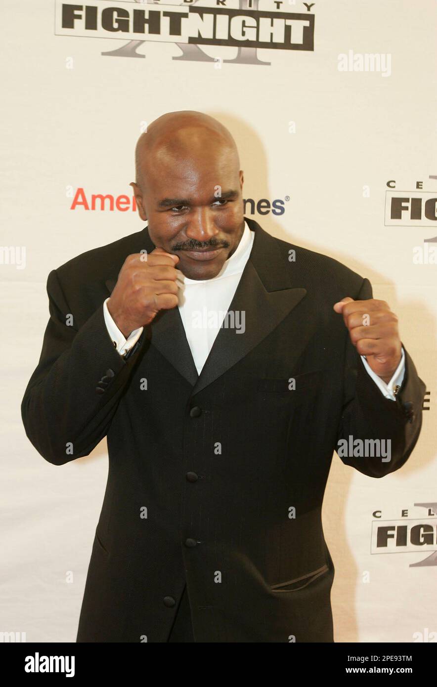 Boxer Evander Holyfield strikes a pose as he walks the red carpet at ...