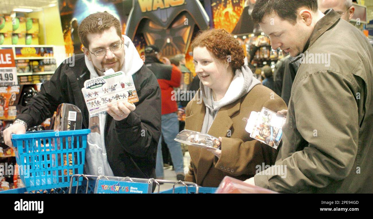 Fans of the "Star Wars" movies, from left, Robert Barney, Megan Linde ...