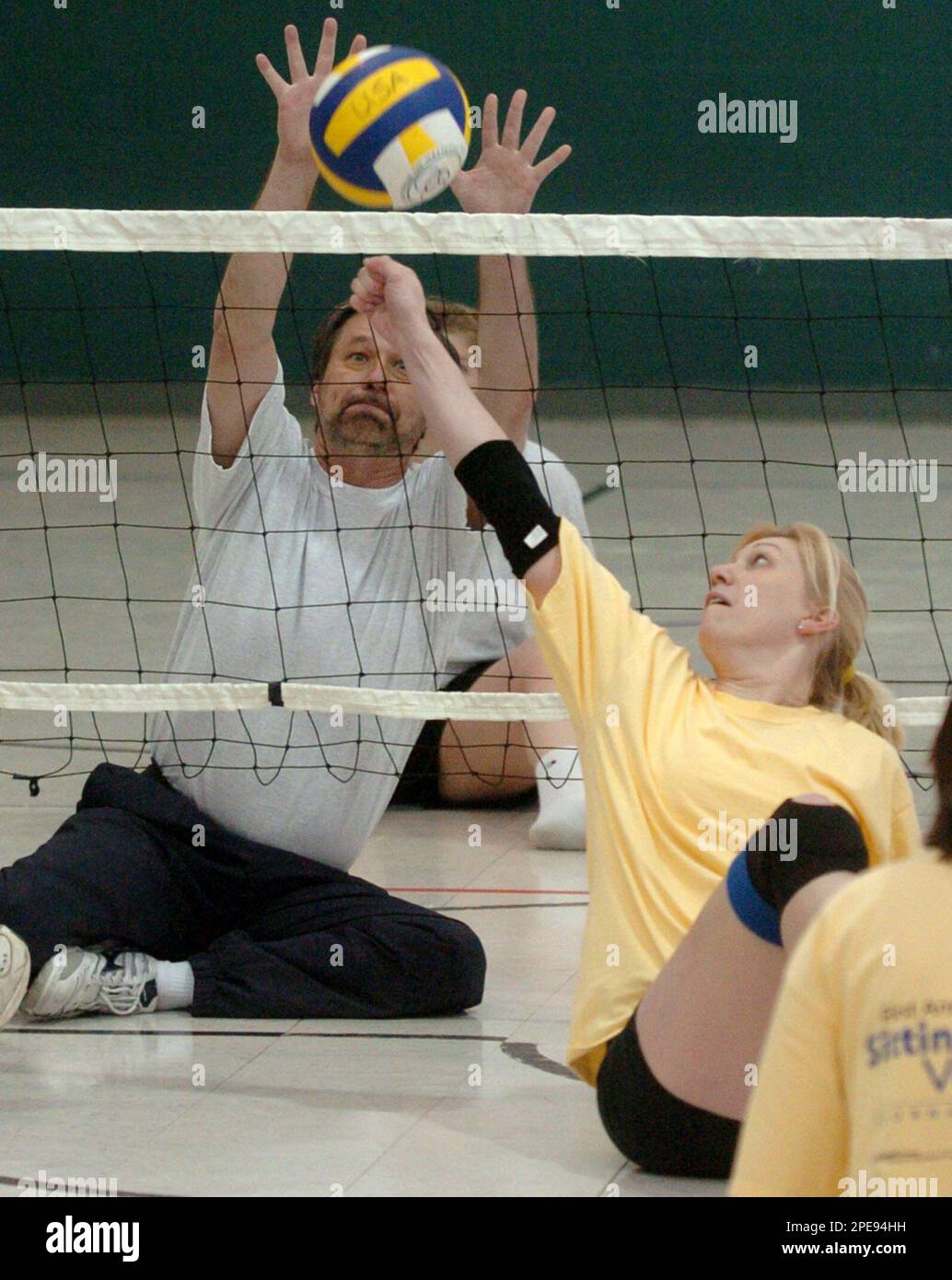 Bill Hamiter, left, and Kim Rasmussen go for a ball during their match ...
