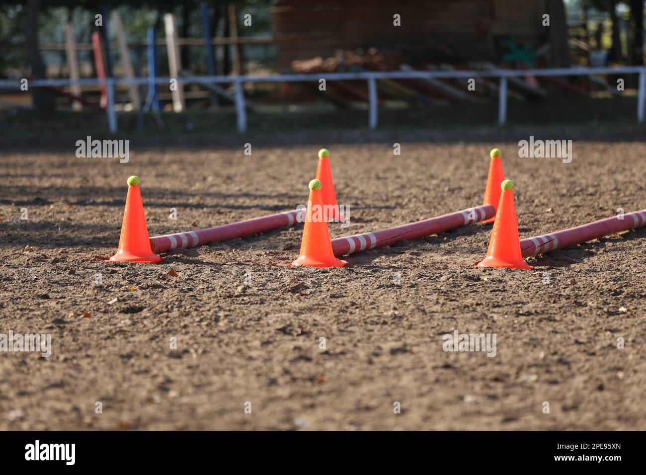 Obstacles and buoys in the sand in an empty equestrian center Stock ...