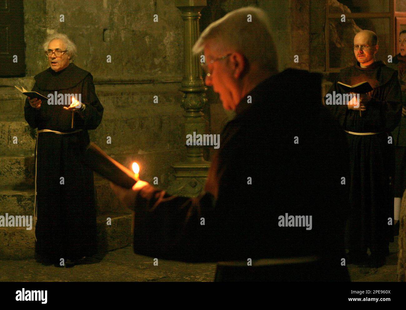 Catholic monks of the Franciscan order pray during a mass at the Church ...