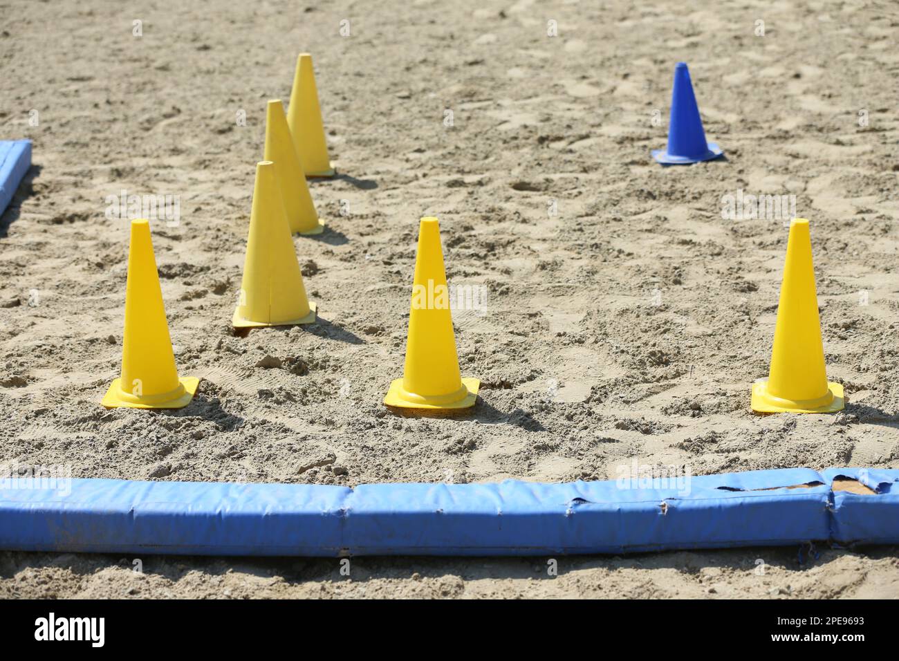 Obstacles and buoys in the sand in an empty equestrian center Stock ...