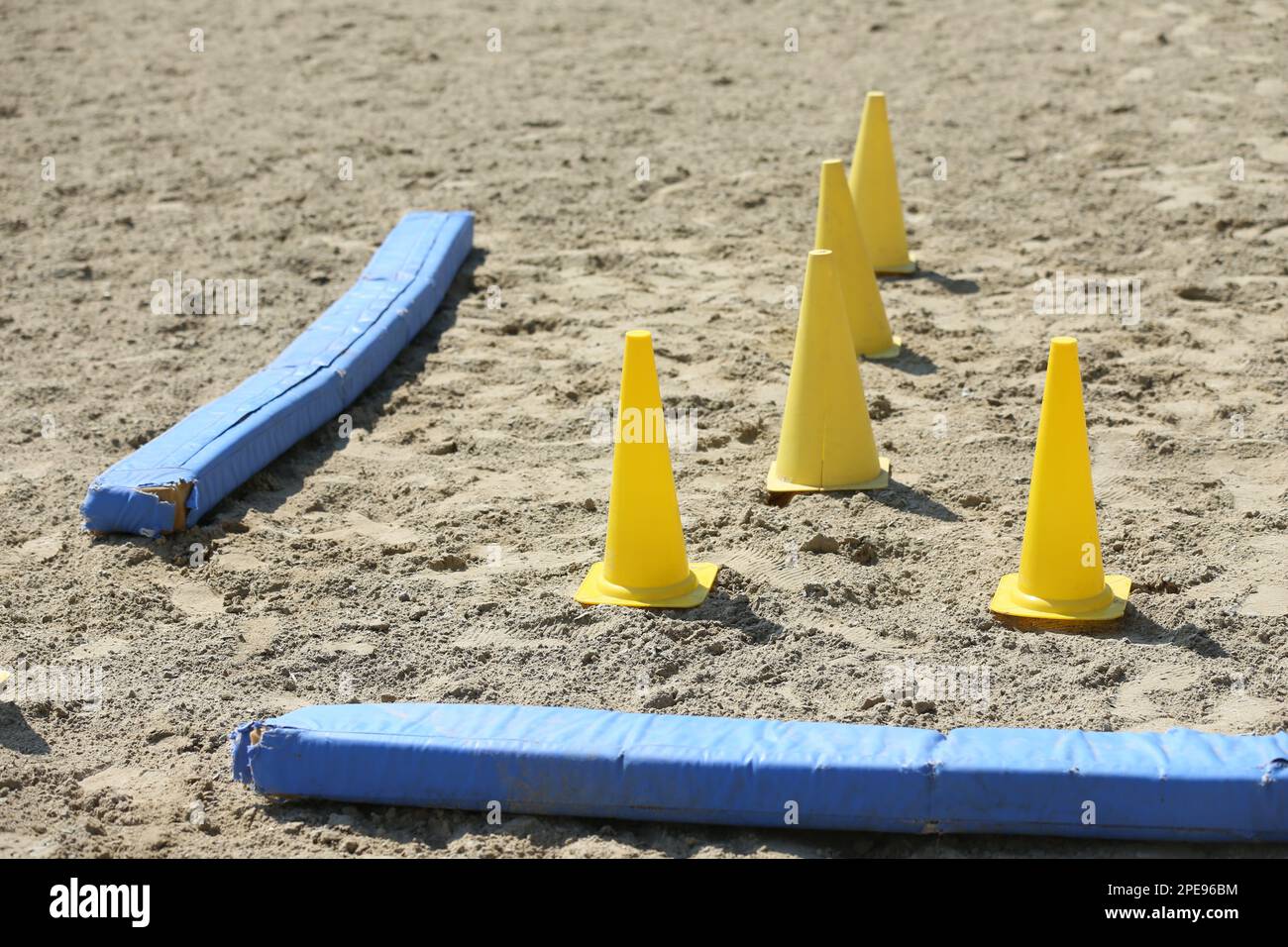 Obstacles and buoys in the sand in an empty equestrian center Stock ...