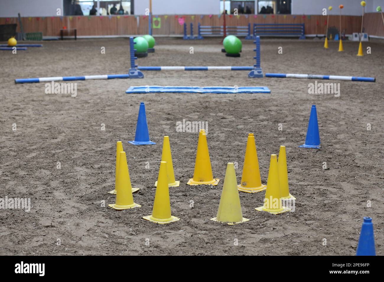 Obstacles and buoys in the sand in an empty equestrian center Stock ...